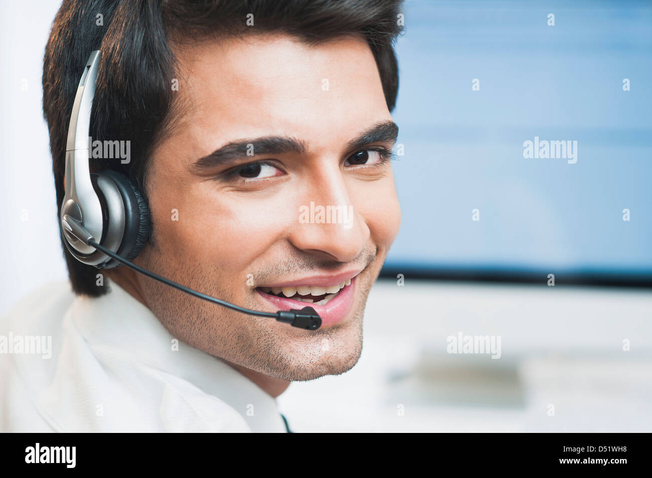Customer service representative wearing a headset and smiling Stock ...