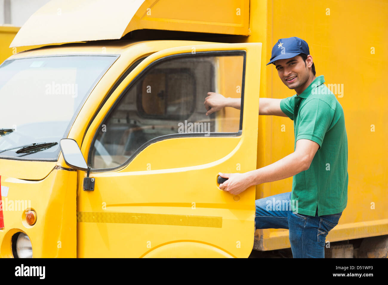 Delivery man opening the door of a van hi-res stock photography and ...