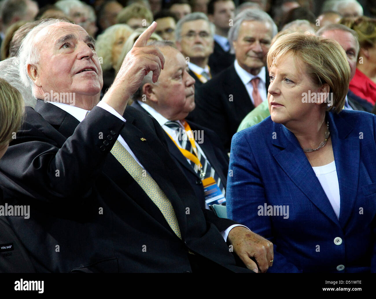 German Chancellor Angela Merkel and former chancellor Hemut Kohl (L ...