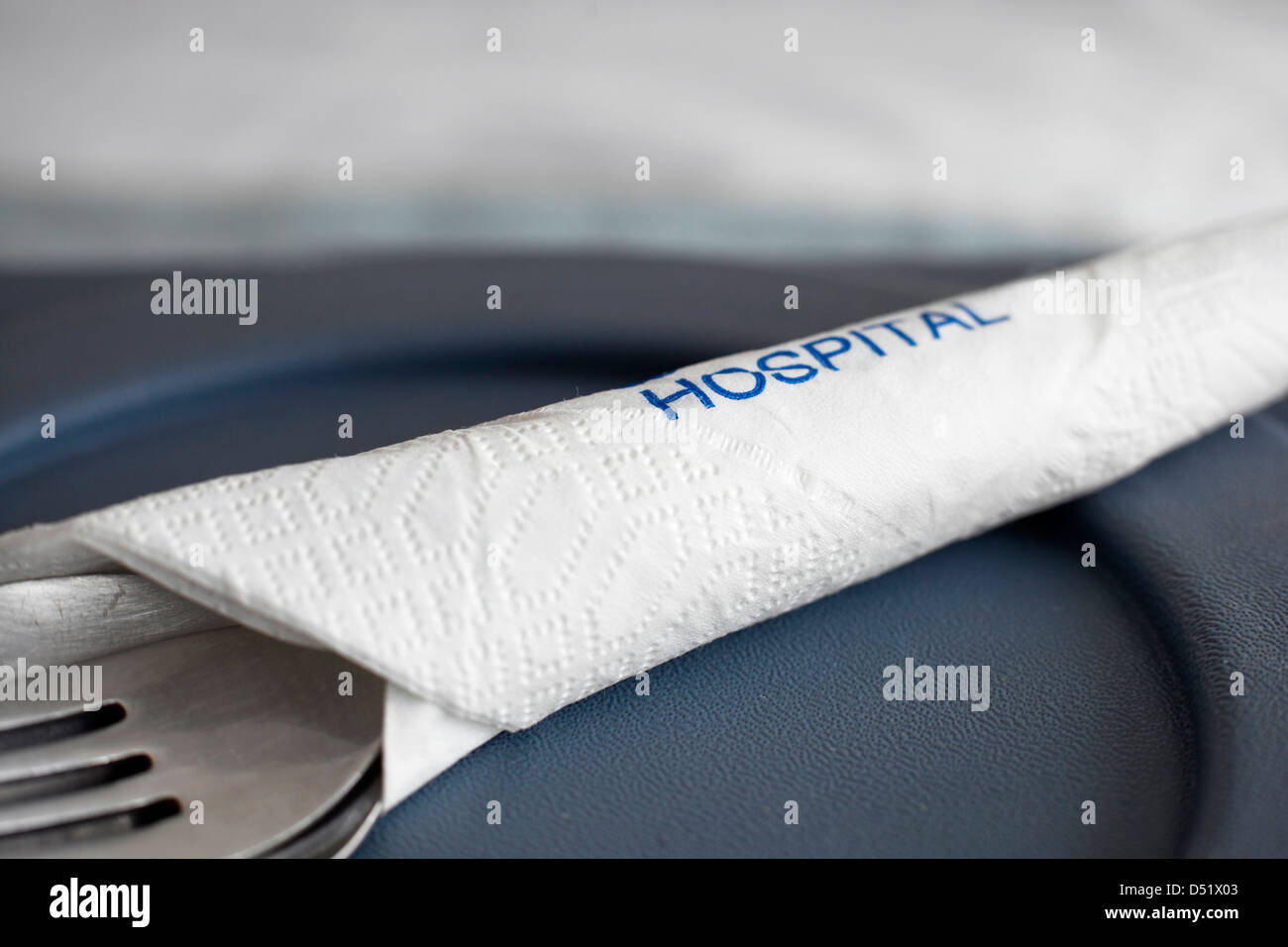 Hospital cutlery rolled up in a paper napkin Stock Photo - Alamy