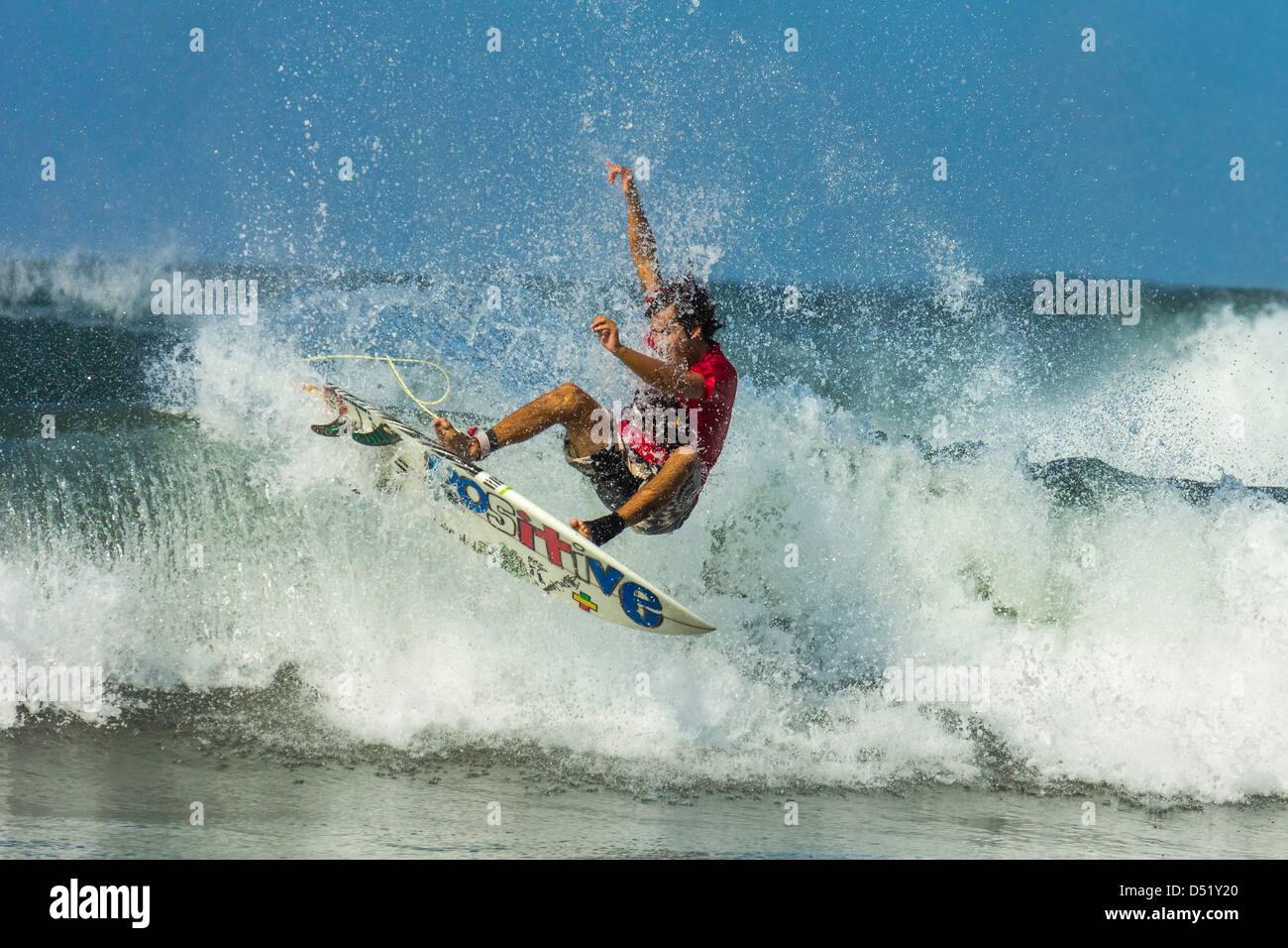Surfer on shortboard riding wave at popular Playa Guiones surf beach ...