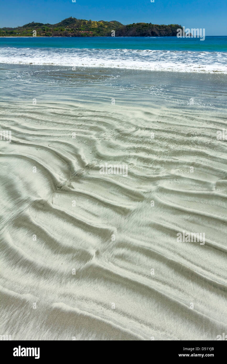 Bands of light sand grains sorted from heavier dark minerals in ...