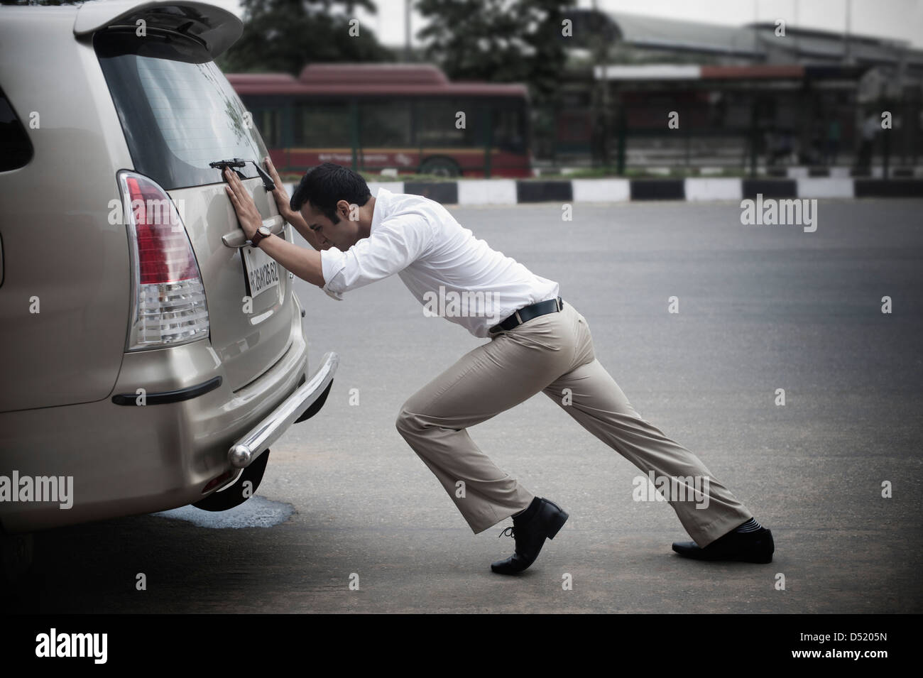 Businessman pushing his car Stock Photo - Alamy Businessman pushing his car Stock Photo - Alamy
