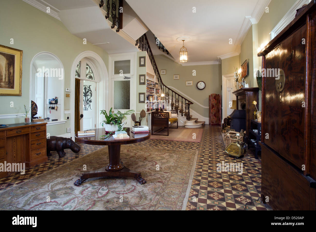 A large period entrance hall and stairs Stock Photo - Alamy