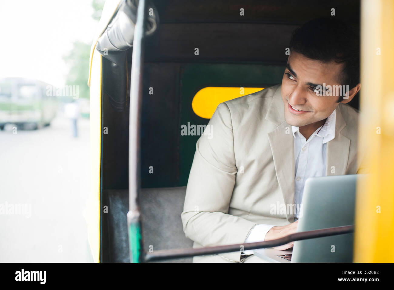 Man sitting in an auto rickshaw hi-res stock photography and images - Alamy