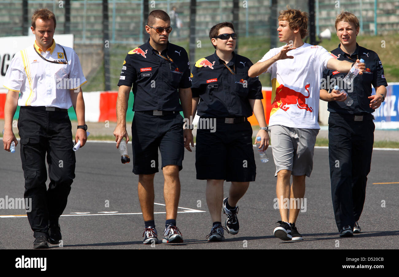 German driver Sebastian Vettel of Red Bull Racing (2-R), his race ...