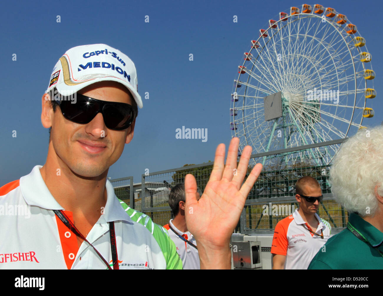 German driver Adrian Sutil of Force India arrives in the paddock of ...