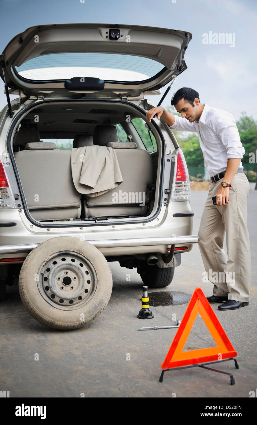 Young businessman holding jack hi-res stock photography and images - Alamy