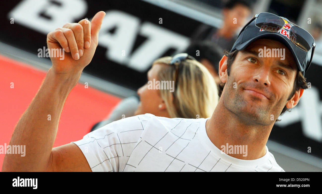 Australian driver Mark Webber of Red Bull Racing thumbs up at Suzuka ...