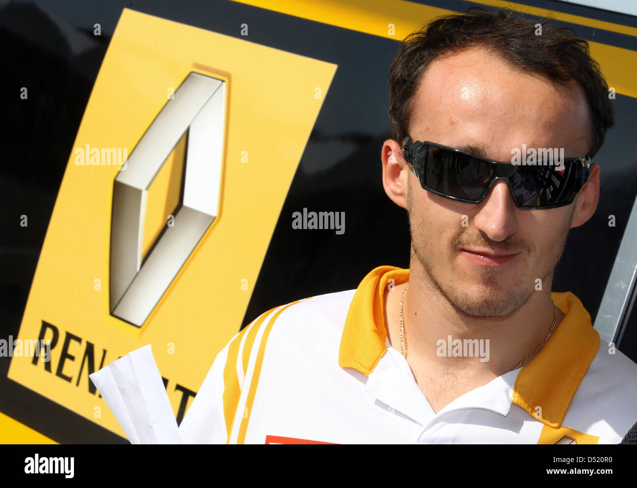 Polish driver Robert Kubica of Renault F1 smiles in the paddock at ...