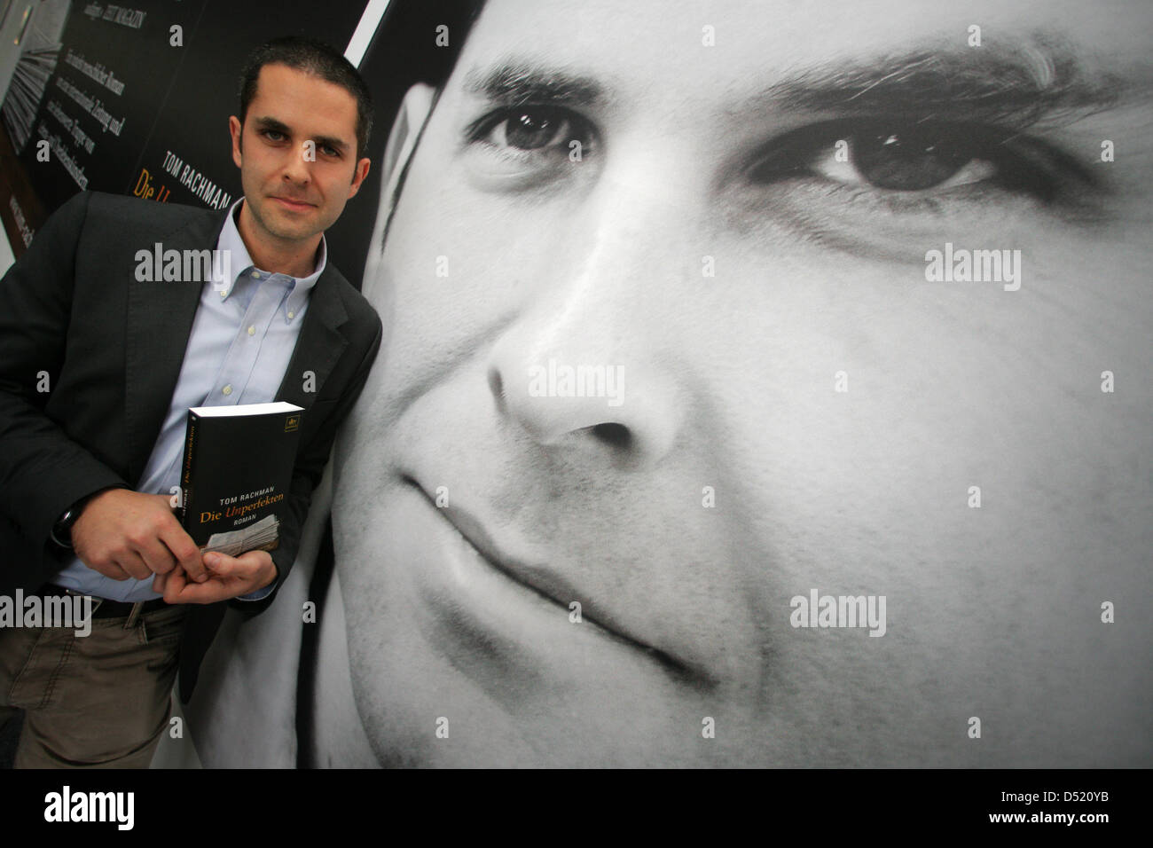 Writer Tom Rachman poses at the Book Fair in Frankfurt Main, Germany ...