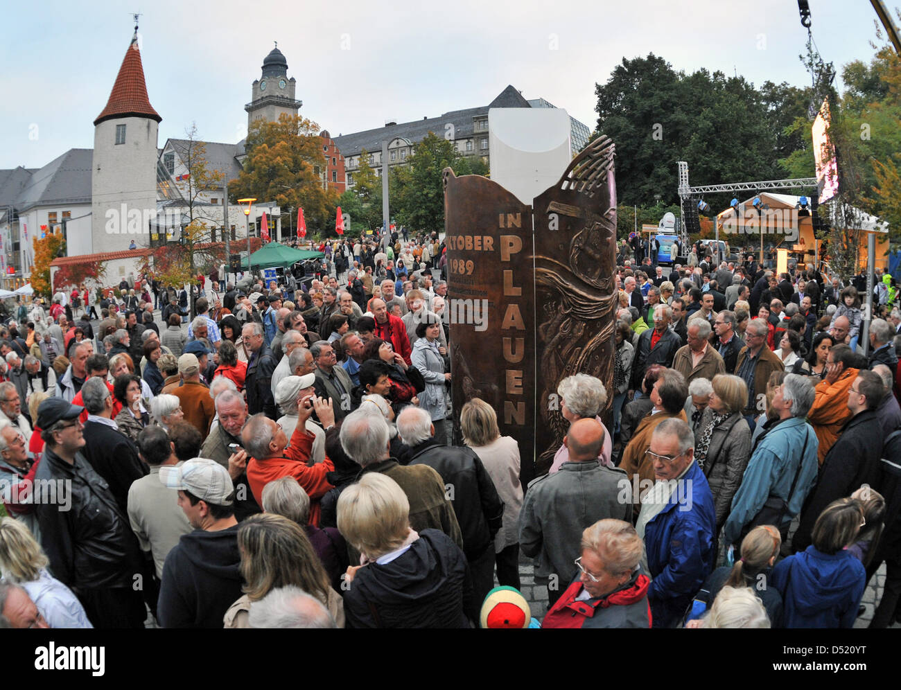 Citizens of Plauen observe the recently unveiled memorial 'Peaceful ...