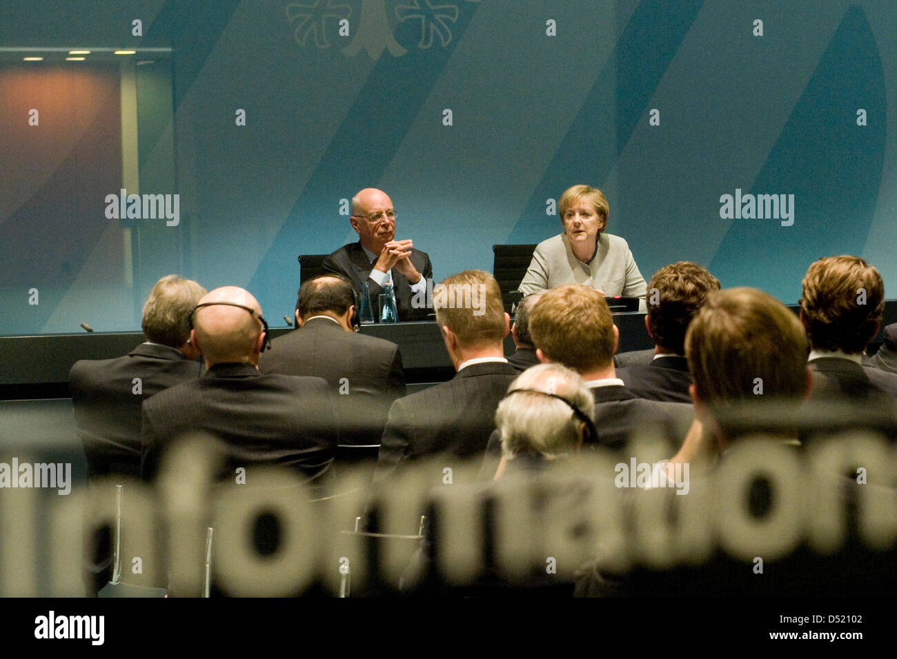 German Chancellor Angela Merkel and President of the World Economic ...
