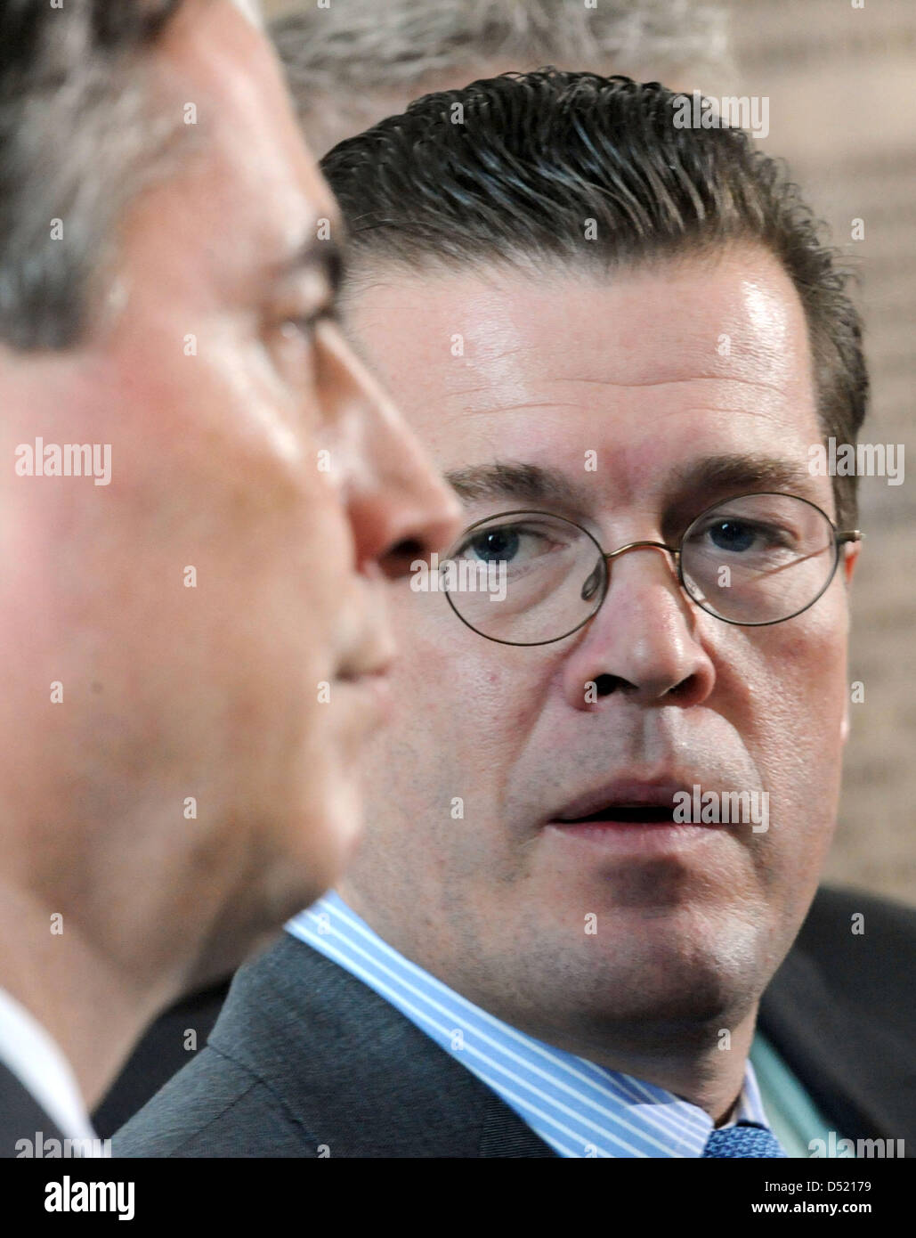 German Minister of Defence Karl-Theodor zu Guttenberg (R) talks to ...