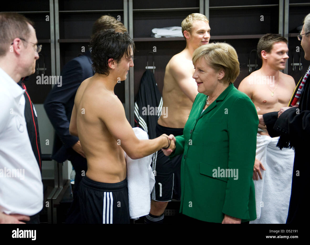 German Chancellor Angela Merkel congratulates the German national ...