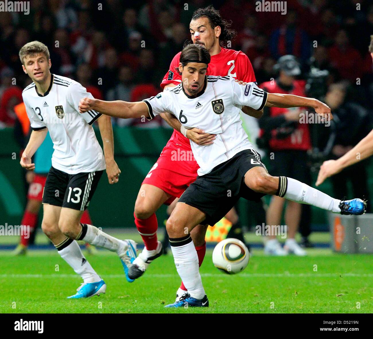 German player Sami Khadira (front) and Turkish player Servet Cetin vie ...