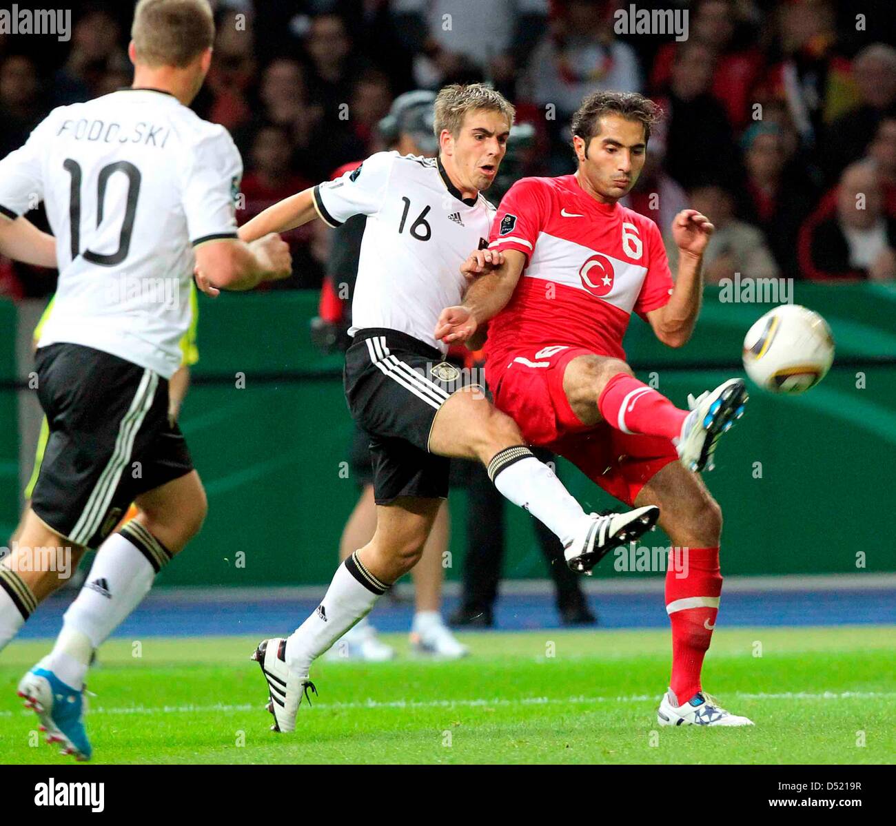 German player Philipp Lahm (L) and Turkish player Hamit Altintop vie ...