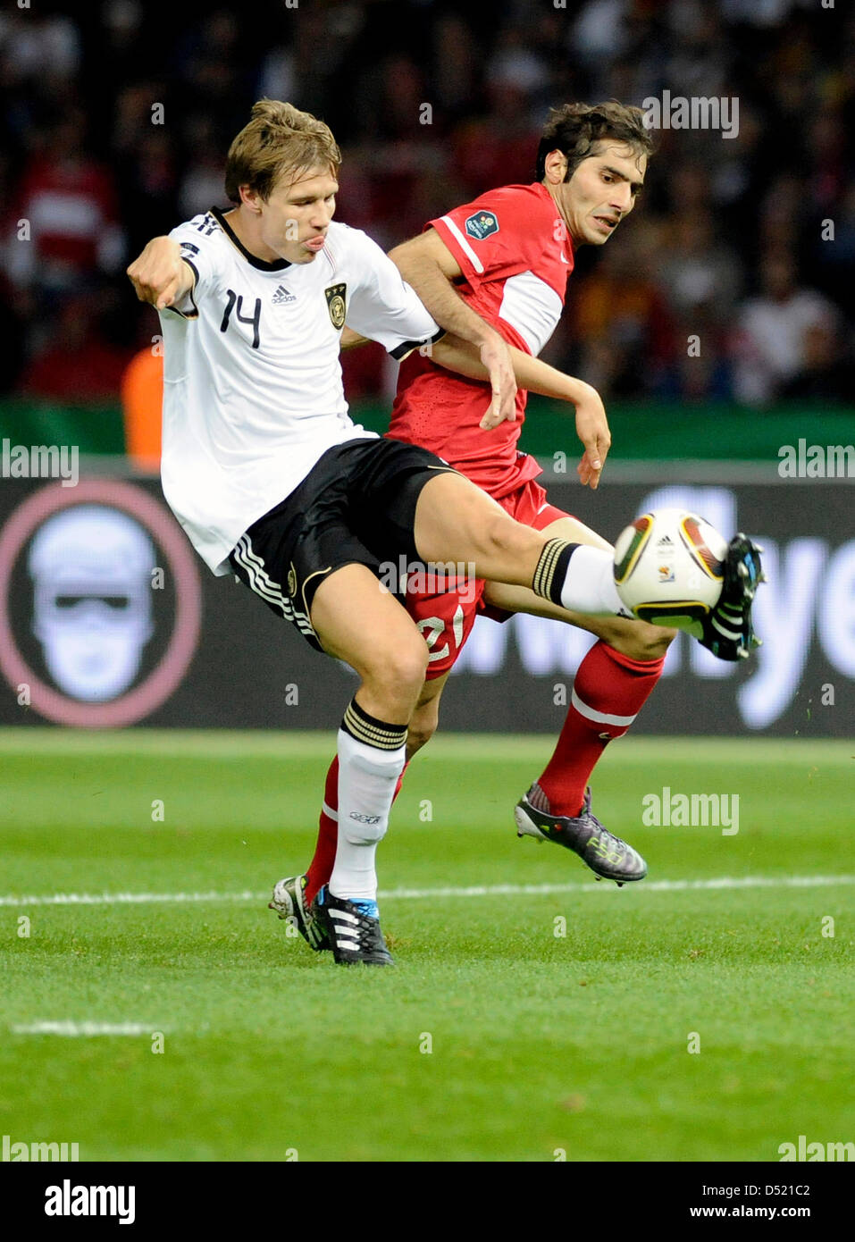 German player Holger Badstuber (L) and Turkish player Halil Altintop ...