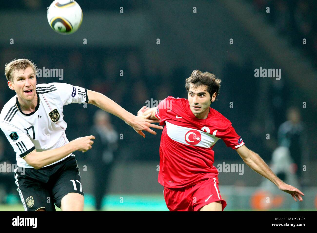 German player Per Mertesacker (L) and Turkish player Halil Altintop vie ...