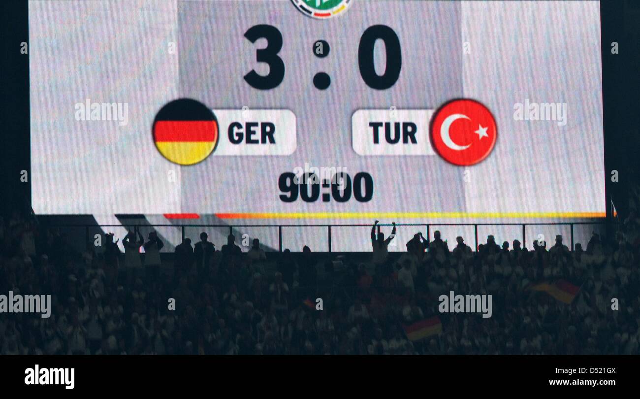 The 3-0 final result of the German team is featured on a large screen ...