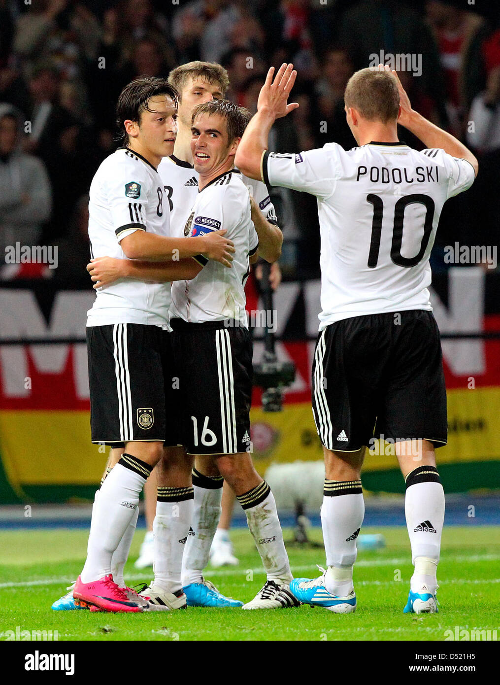 German players Philipp Lahm (2-R), Thomas Mueller (back) and Lukas ...