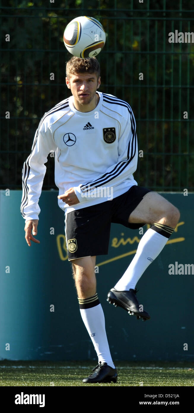 Player of the German national soccer team, Thomas Mueller, warms up in ...