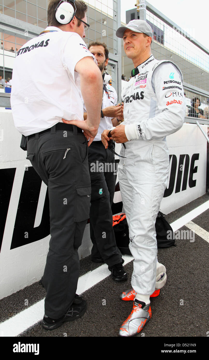 German Michael Schumacher of Mercedes GP talks to racing engineer ...