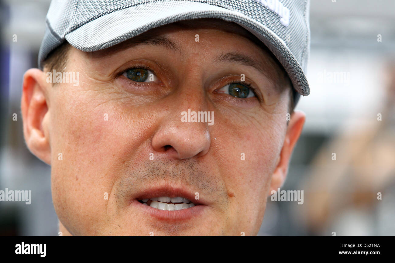 German Michael Schumacher of Mercedes GP talks to his racing engineer ...