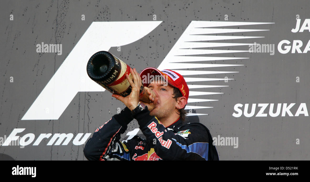 German formula one driver Sebastian Vettel of Team Red Bull drinks from ...
