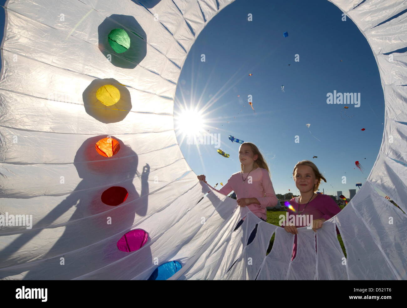 Denise Holze (L) and her sister Jessica spin a so-called 'Bowle' at one ...