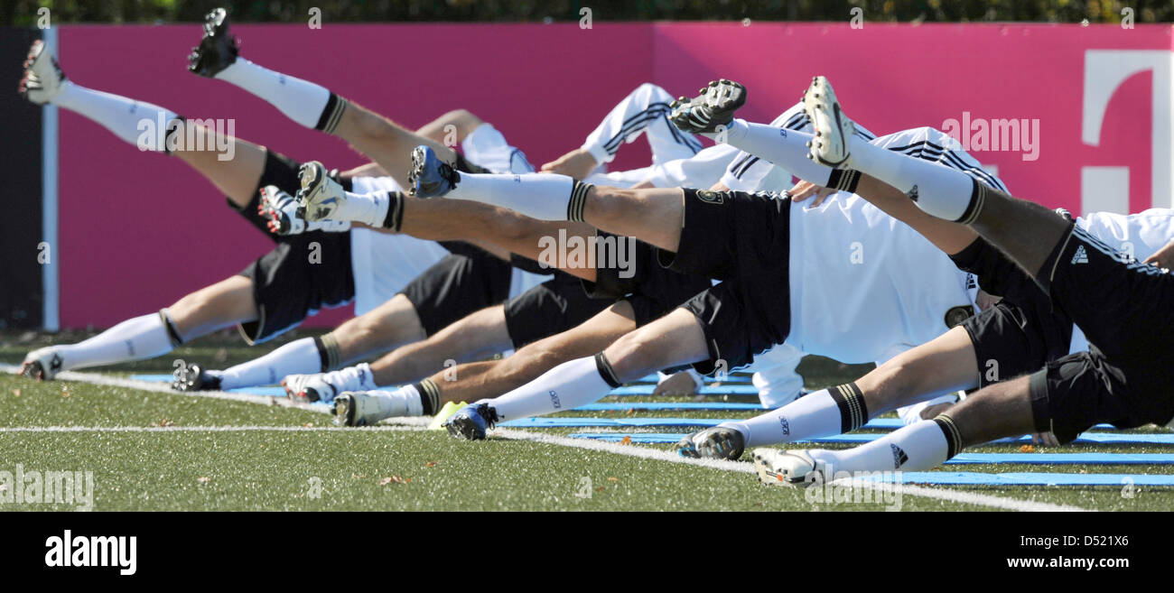Players of the German national soccer stretch on artifical turf in a ...