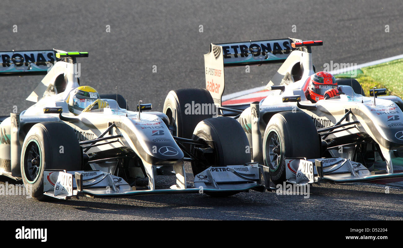 German formula one driver Michael Schumacher (R) of Team Mercedes GP ...