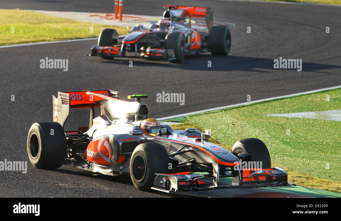 British formula one driver Lewis Hamilton (front) of Team McLaren ...