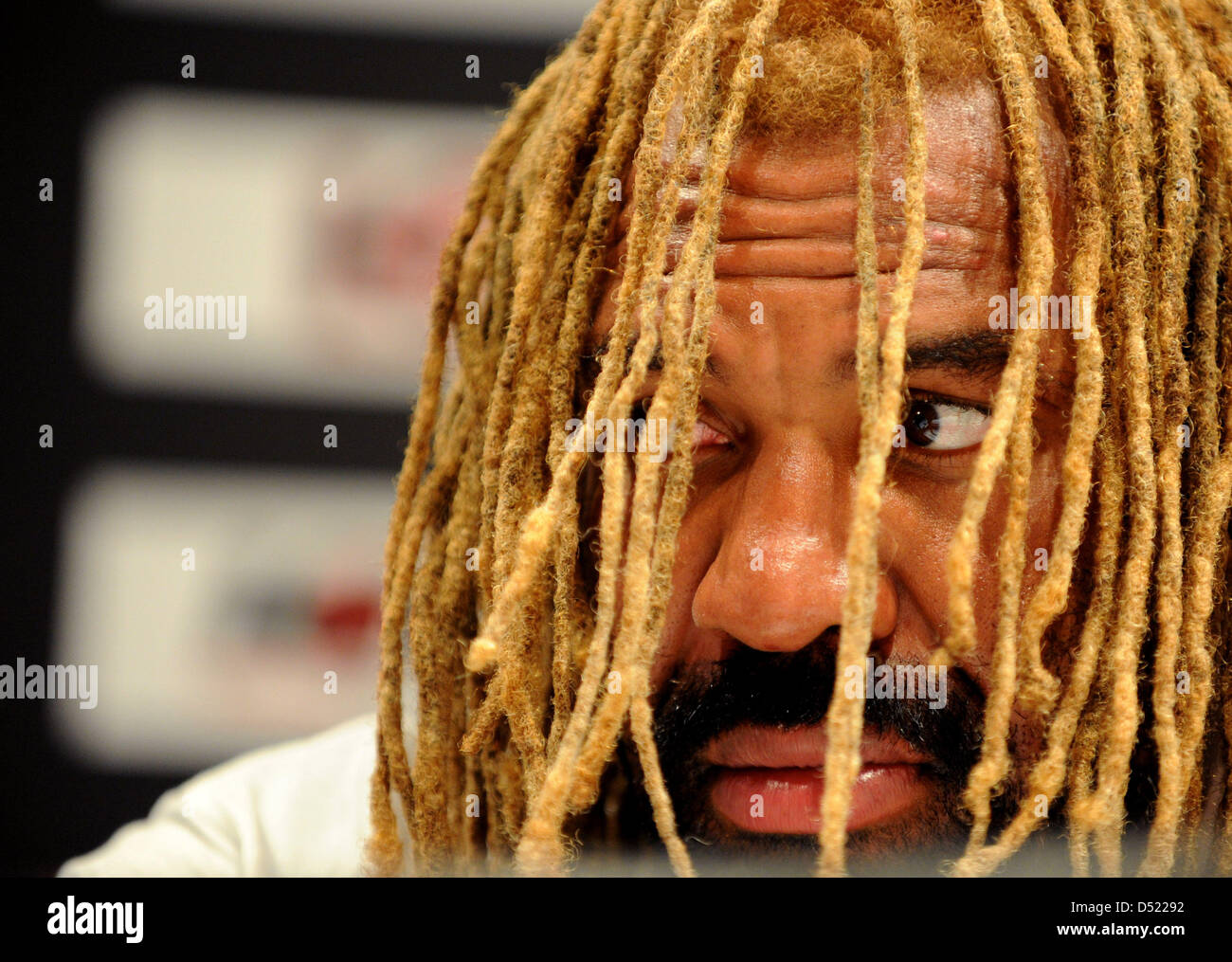 US heavyweight boxer Shannon Briggs peers out from under his braided ...
