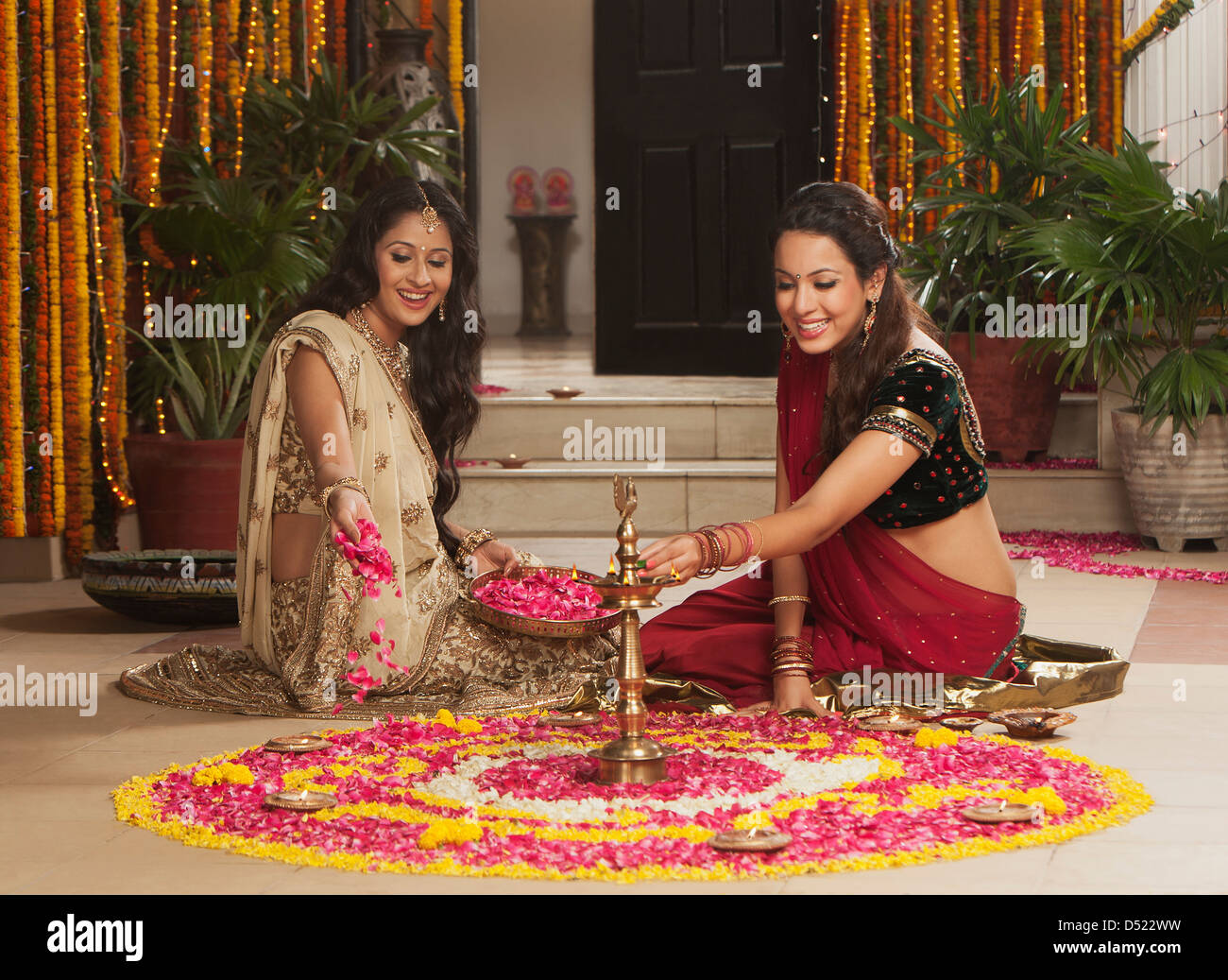 Indian women making rangoli hi-res stock photography and images - Alamy