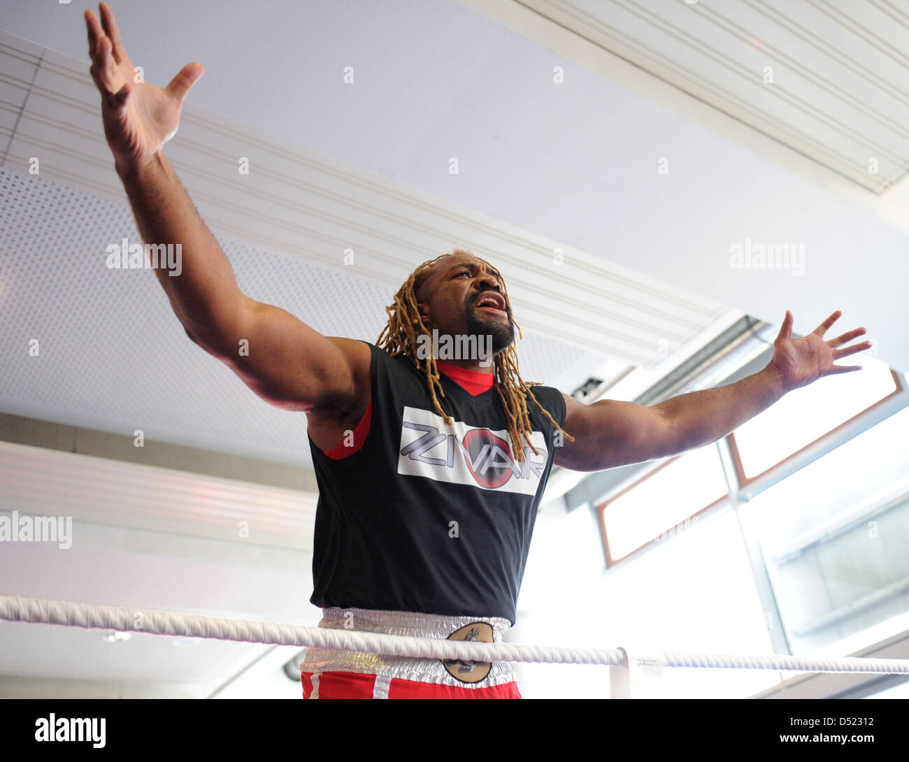 Challenger Shannon Briggs leans over the ring during a public training ...