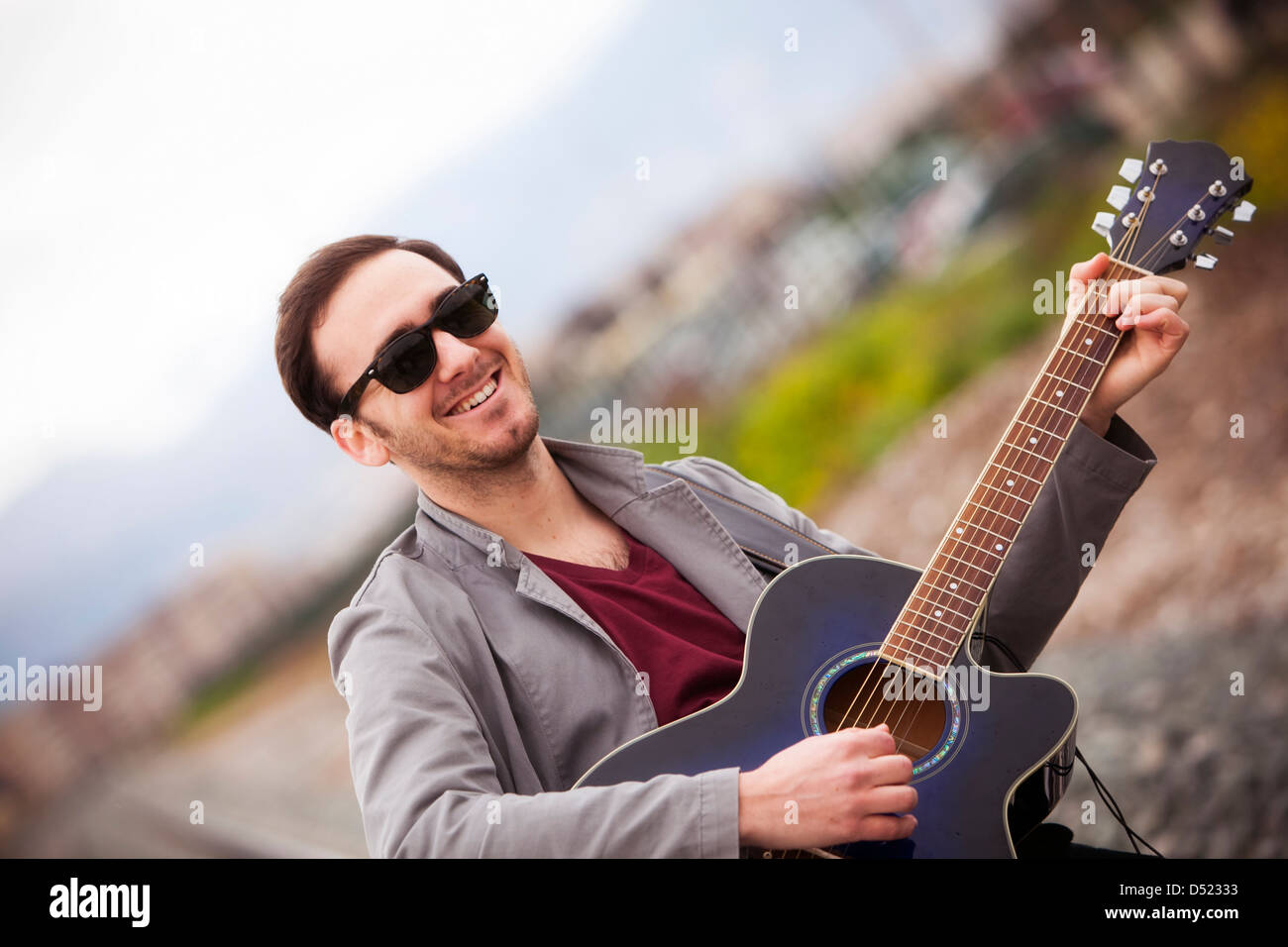 Lone handsome male musician on his way Stock Photo - Alamy