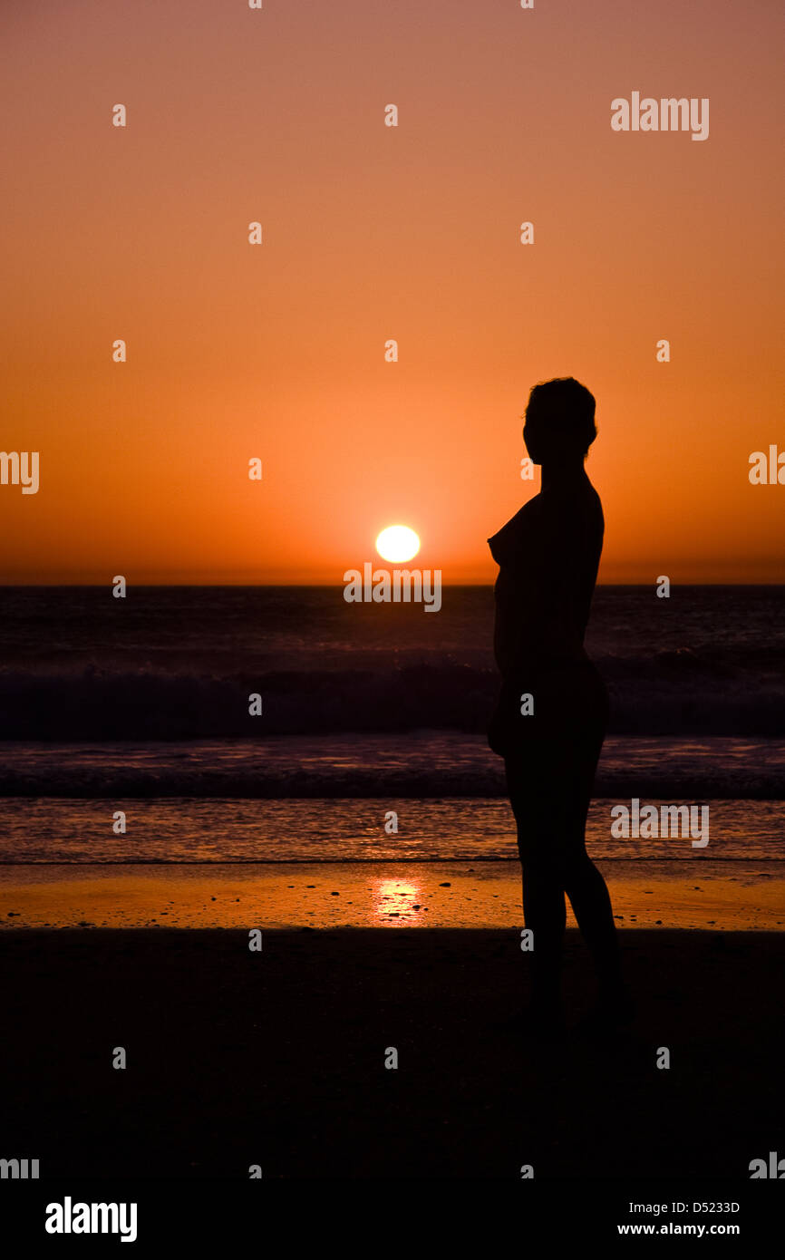 Young Woman in sunset Stock Photo - Alamy