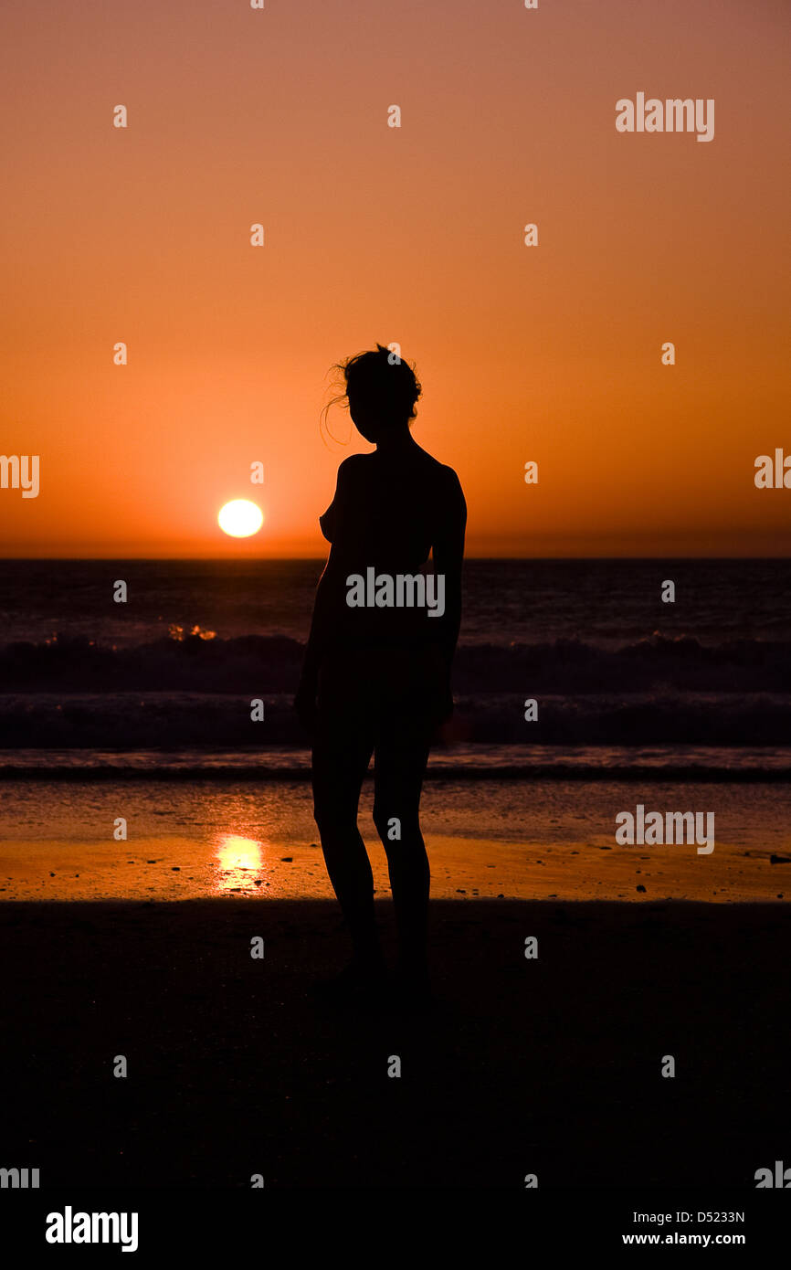 Young Woman in sunset Stock Photo - Alamy
