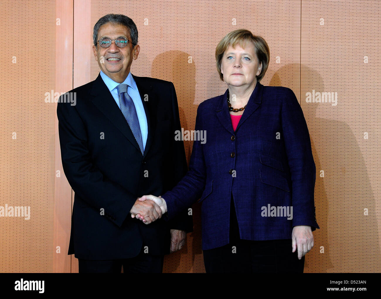 German Chancellor Angela Merkel poses with General Secretary of the ...