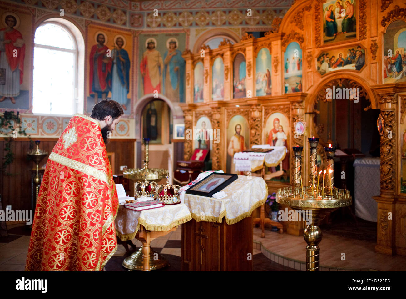 Catholic priest during consecration in hi-res stock photography and ...