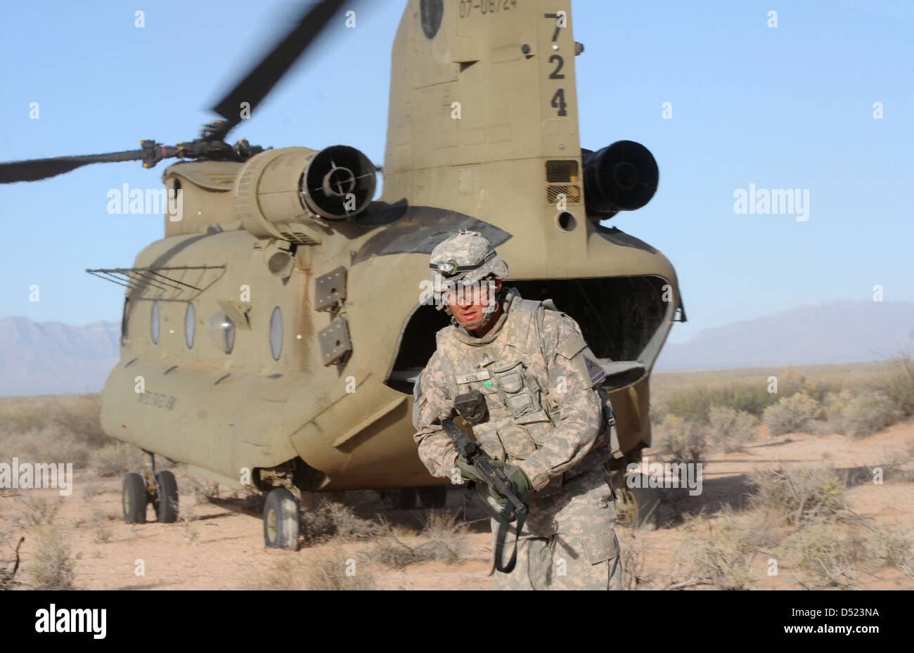 US Army soldiers exit from the back of a CH43 Chinook helicopter during ...