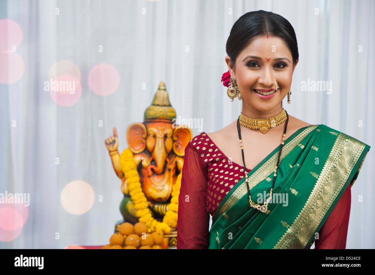 Woman at ganesh chaturthi hi-res stock photography and images - Alamy