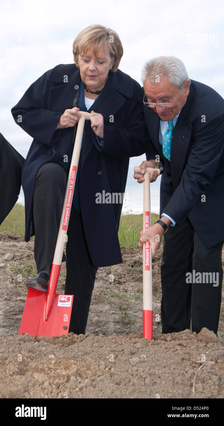 German Chancellor Angela Merkel and IBC Solar CEO Udo Moehrstedt make ...