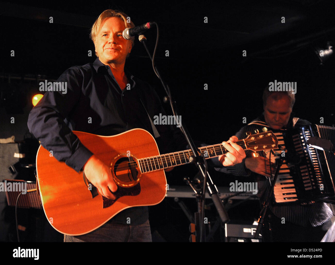 Singing US actor Tim Robbins (L) performs on stage during the first of ...