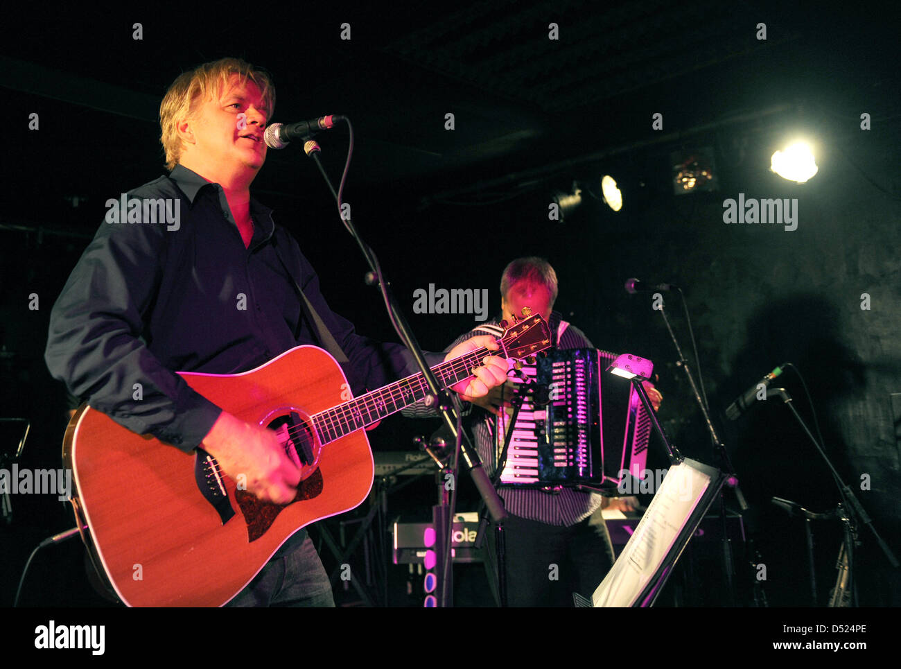 Singing US actor Tim Robbins (L) performs on stage during the first of ...