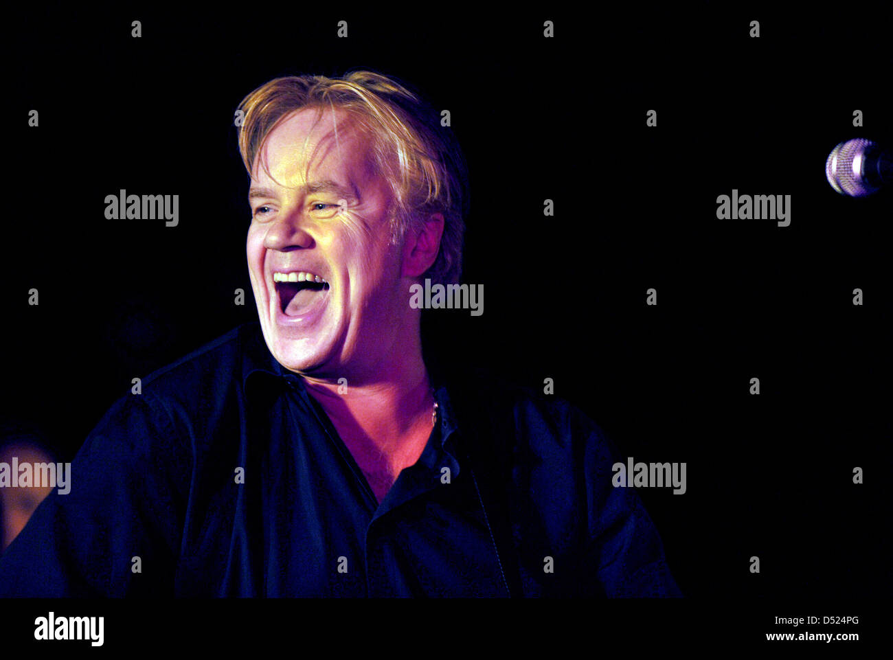 Singing US actor Tim Robbins performs on stage during the first of his ...
