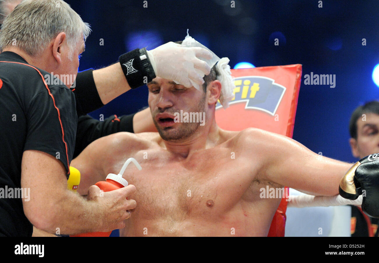 Ukrainian boxer Vitali Klitschko sits in a corner of the ring, while ...