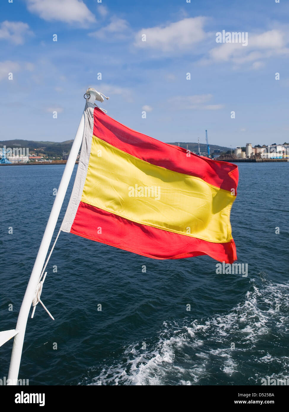 Spain flag waving in the sea in a sunny, breezy day Stock Photo - Alamy