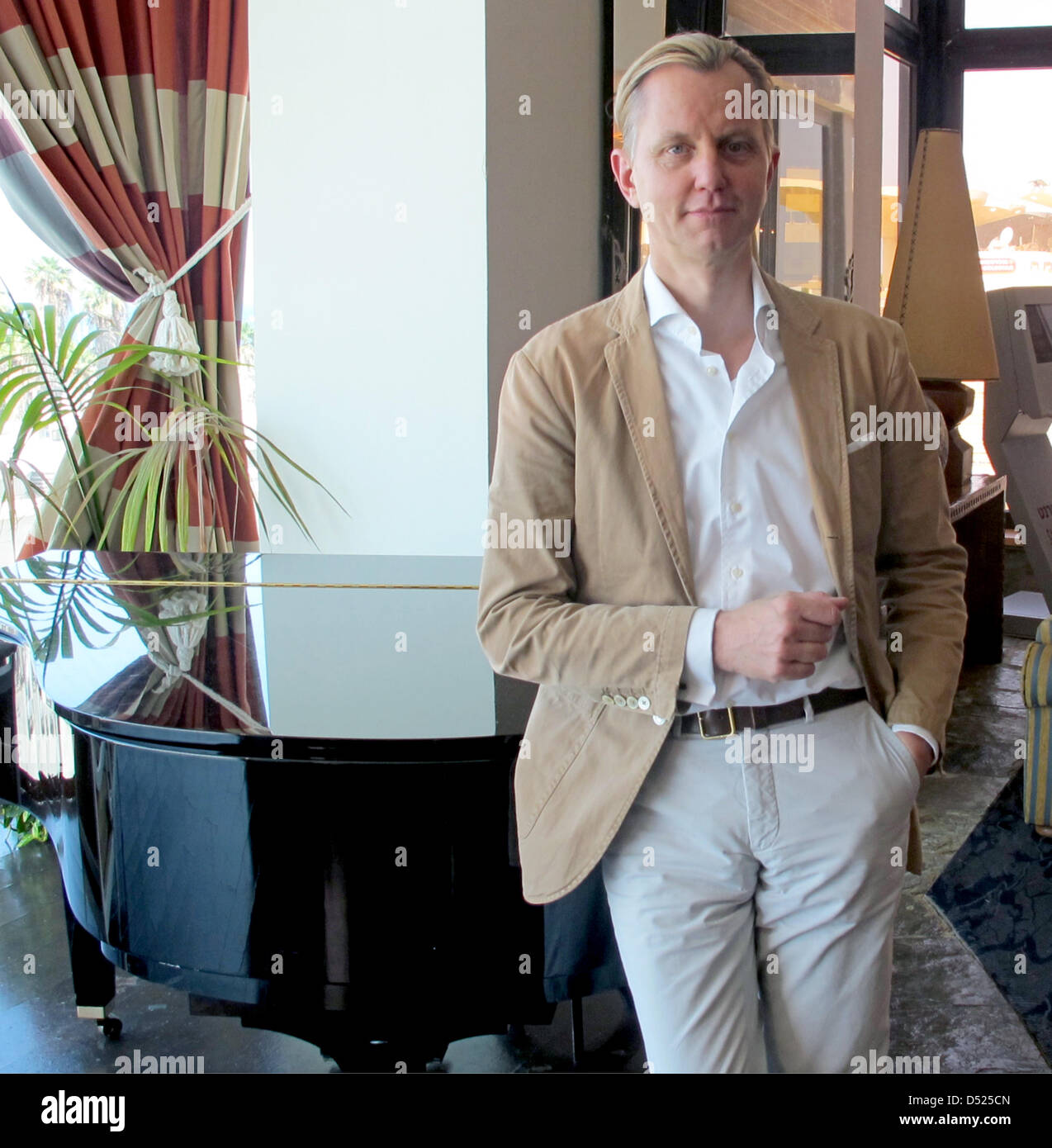German chansonnier Max Raabe leans on a piano at a hotel in Tel Aviv ...